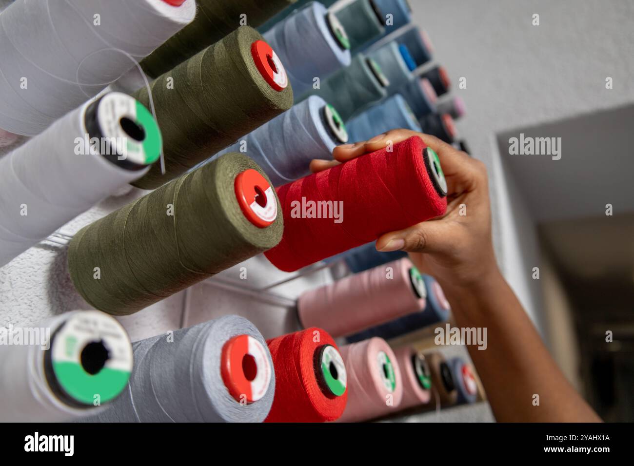 Professional woman seamstress works on hi-res stock photography and ...