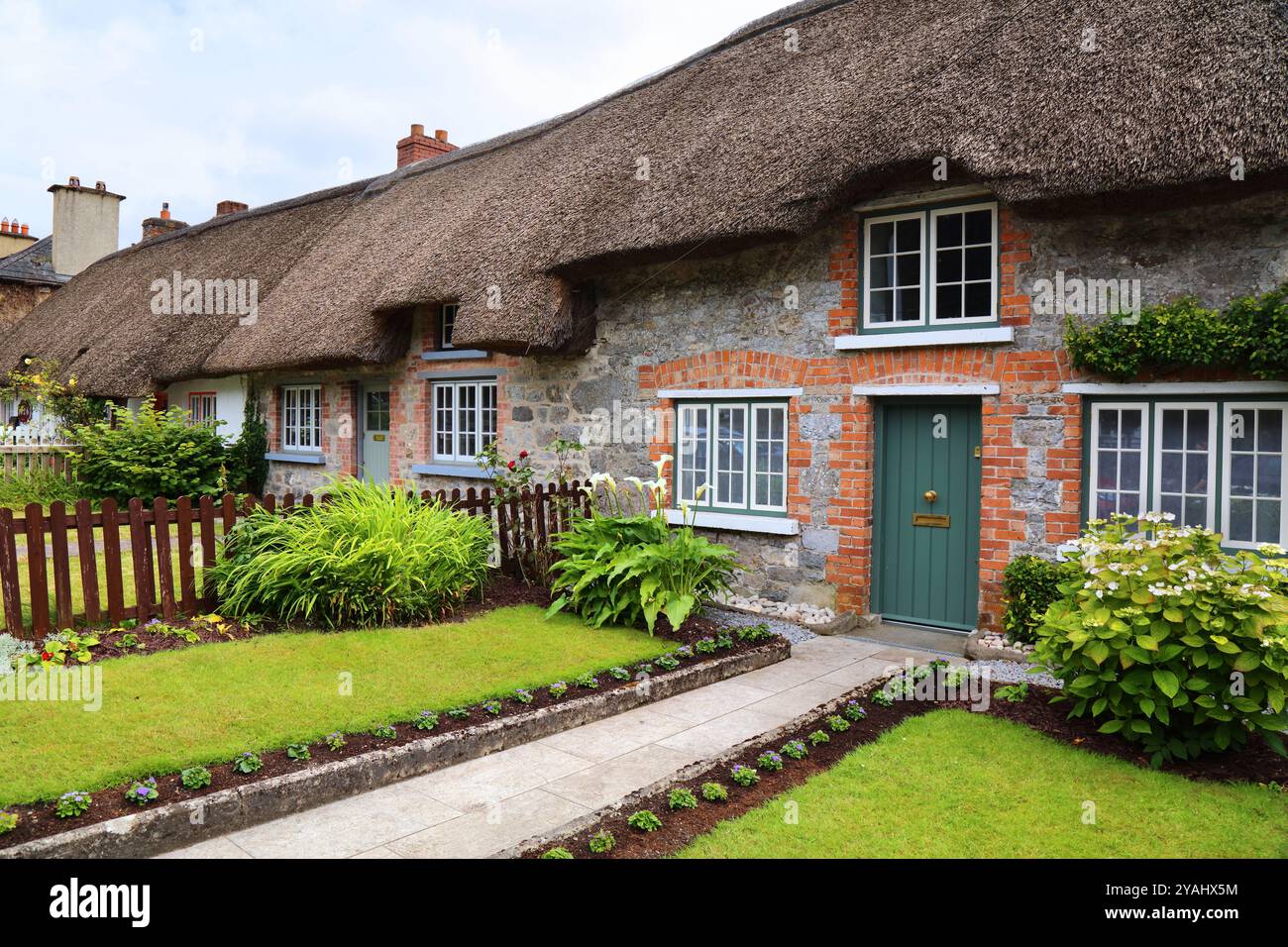 Thatched roofs of Adare village in County Limerick in Ireland. Adare is ...