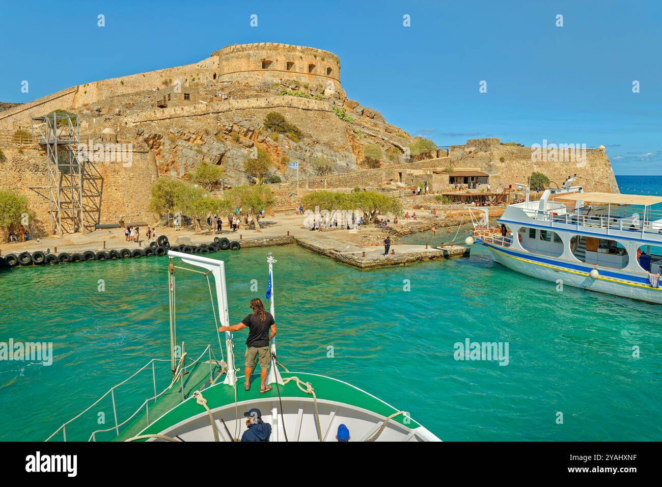 Tour boat arriving at Spinalonga island located north of Agios Nikolaos ...