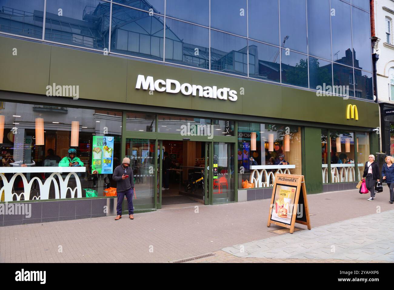 SUTTON, UK - JULY 8, 2024: People visit McDonald's fast food restaurant ...