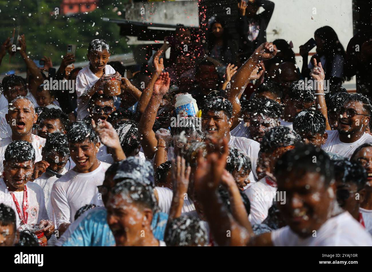 Sindhupalchok, Nepal. 14th Oct, 2024. Participants attend the curd ...