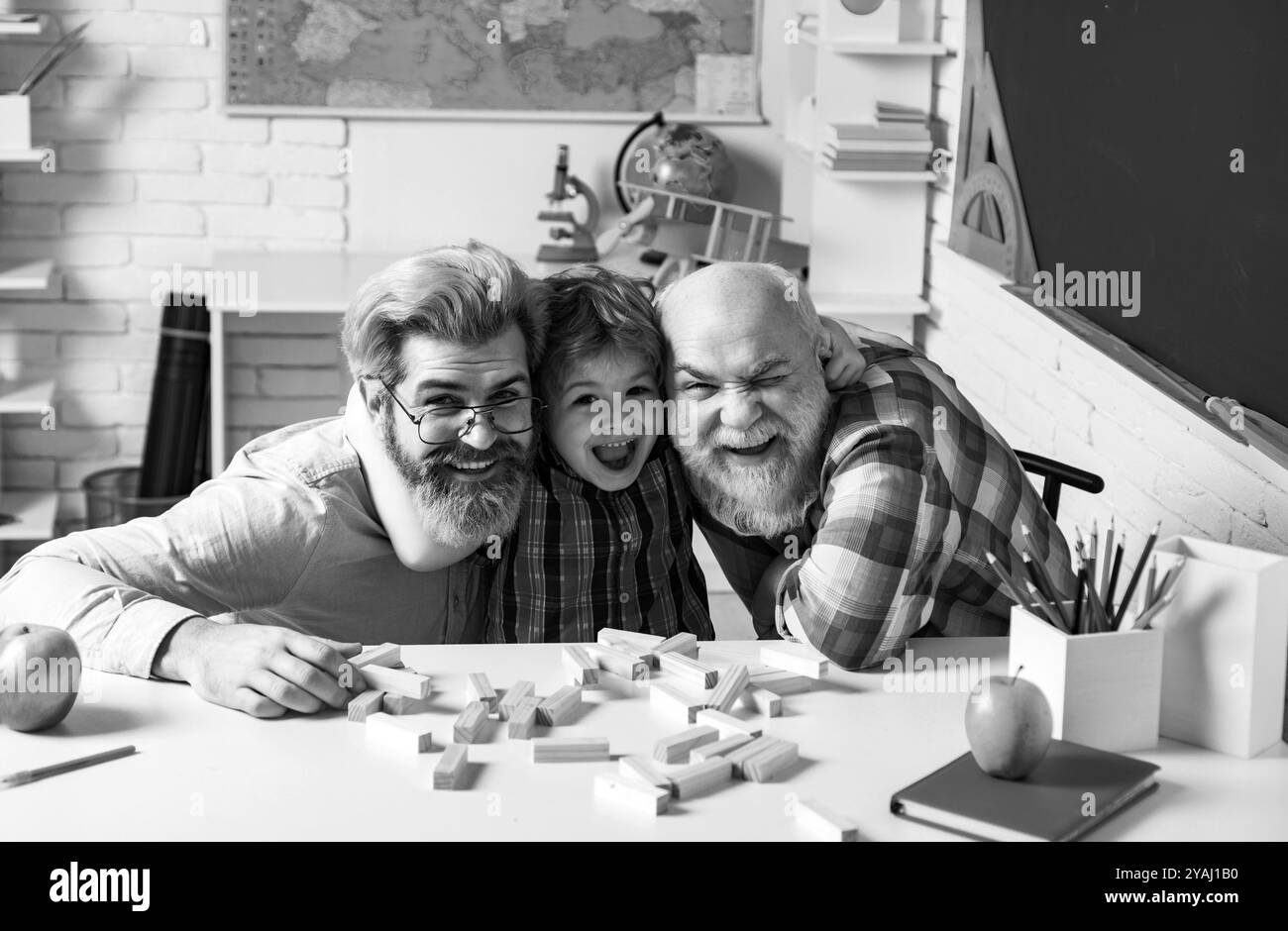 Grandfather father and son playing games, men generation, happy little ...