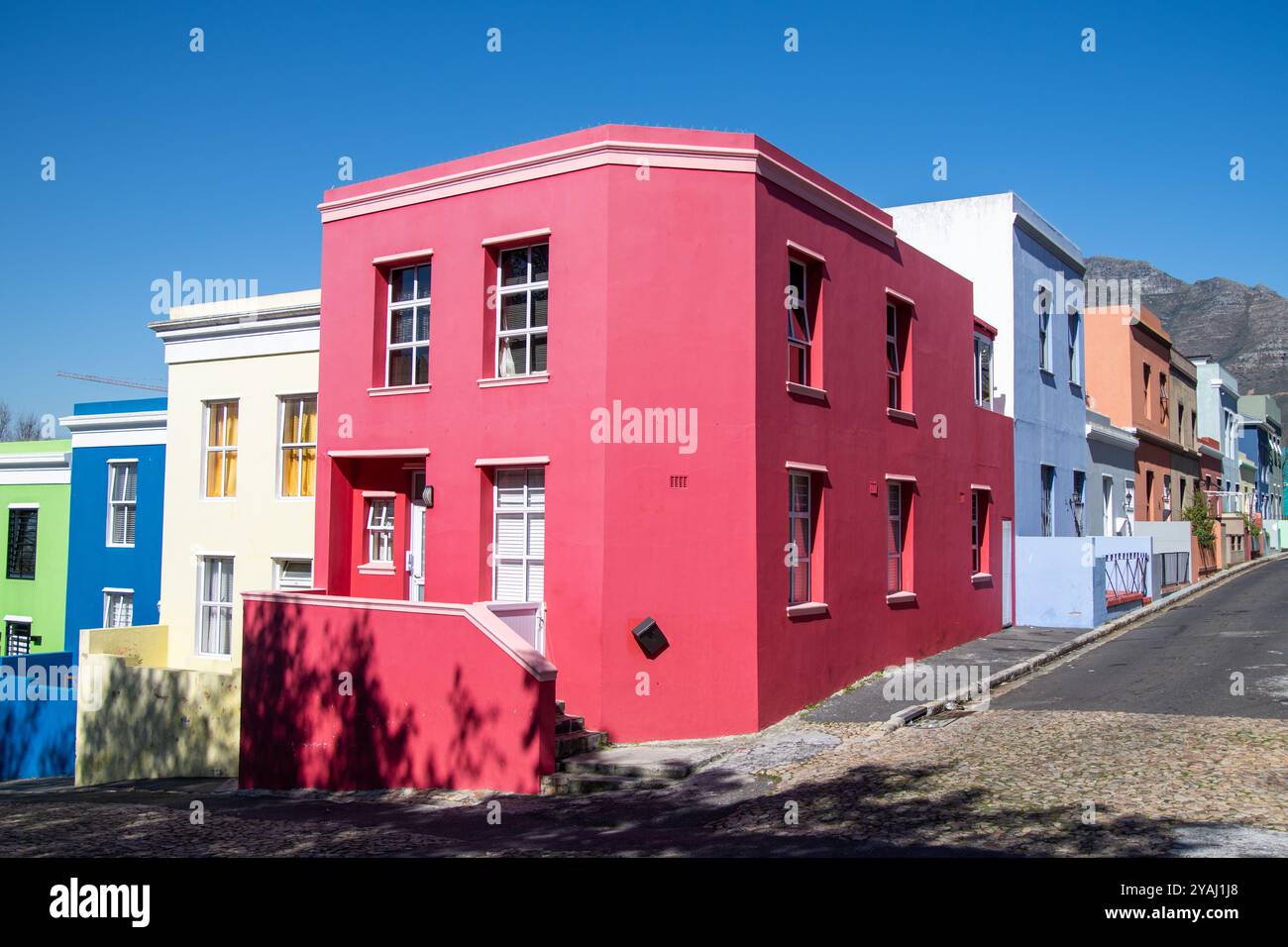 The brightly coloured houses and buildings of the Bo-Kaap neighbourhood ...