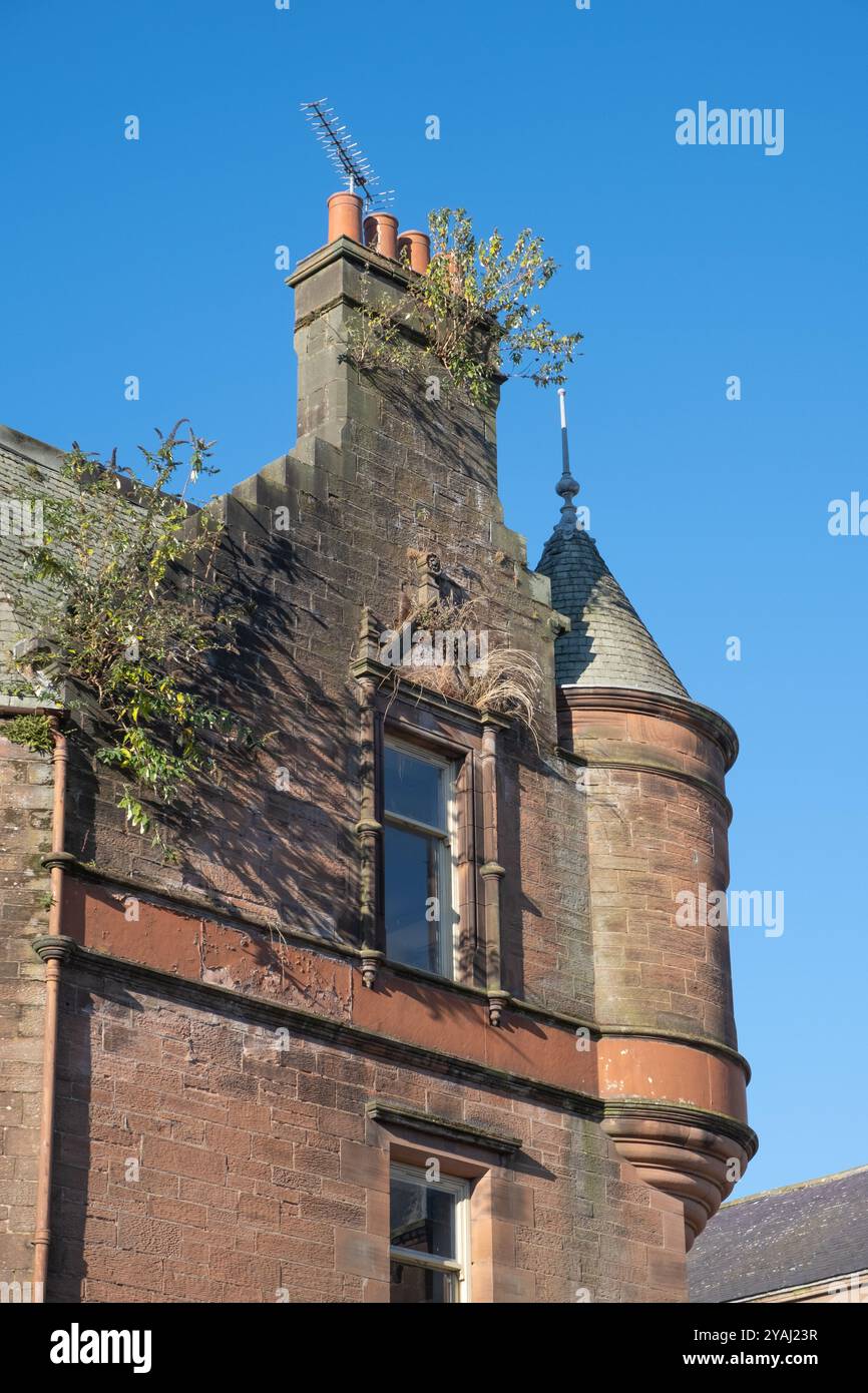 Looking up at a red sandstone building on the corner of Shakespeare and ...
