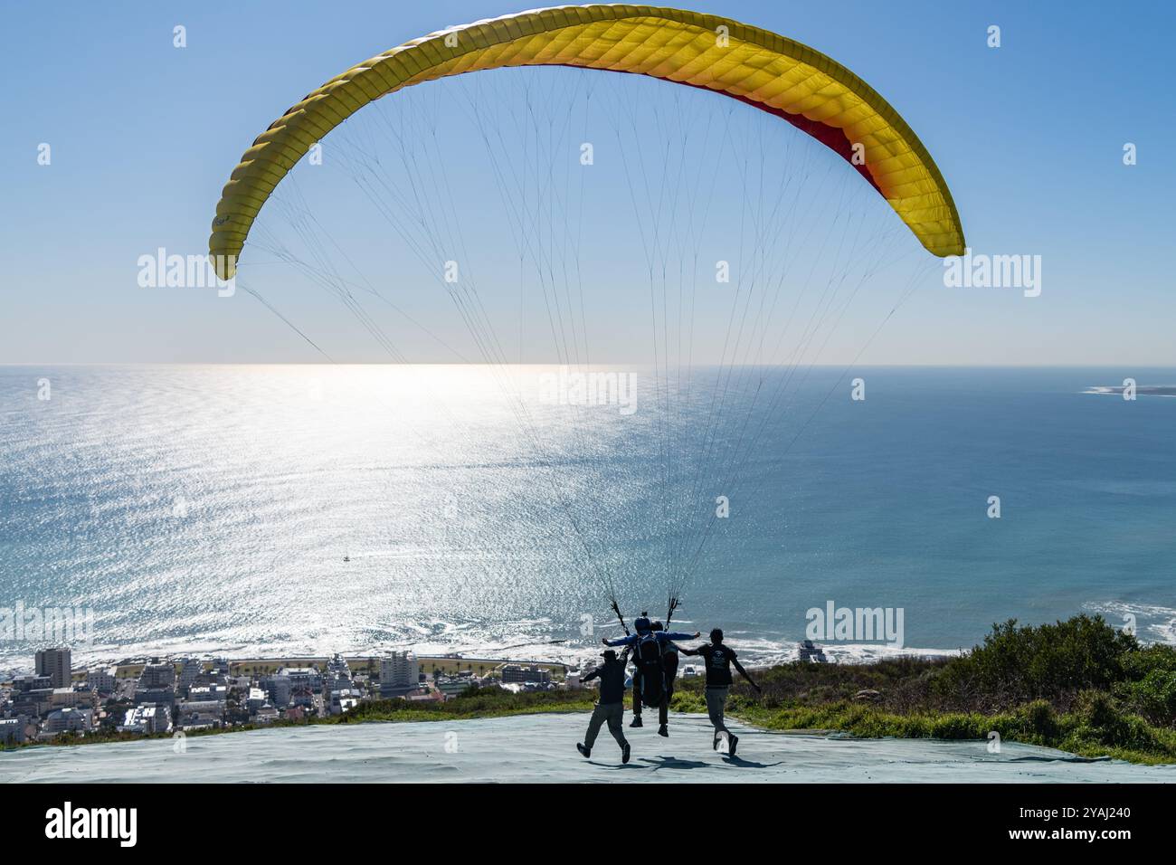 A paraglider taking off from the launch site on Signal Hill in Cape ...