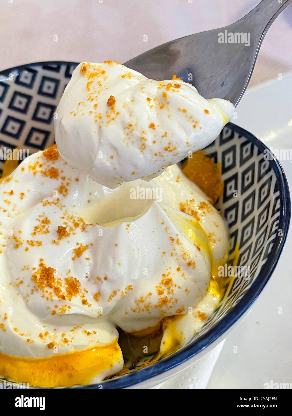 Eating creamy dessert. Close view Stock Photo - Alamy