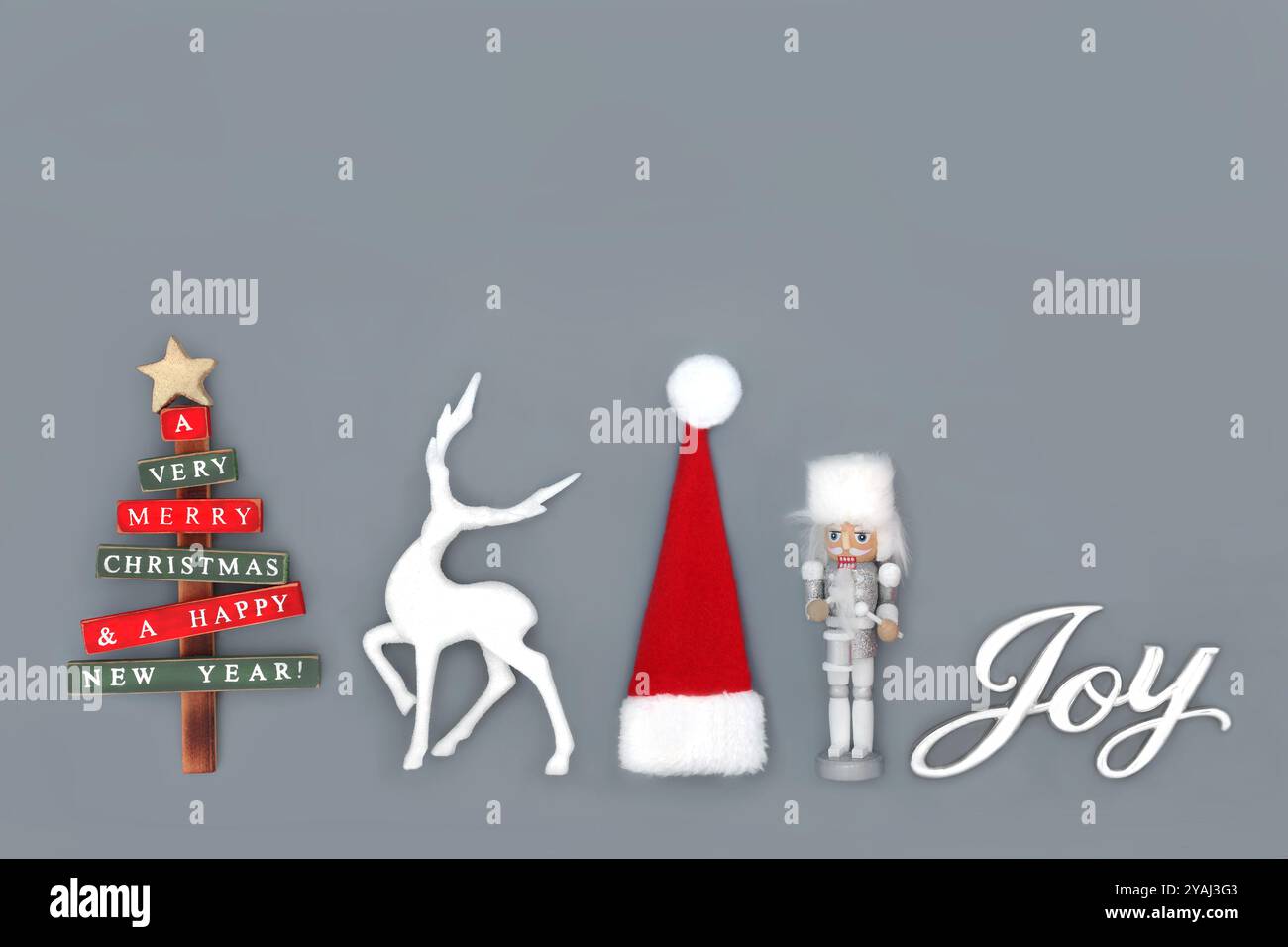 Christmas Eve Joy sign with traditional bauble tree decorations on gray ...