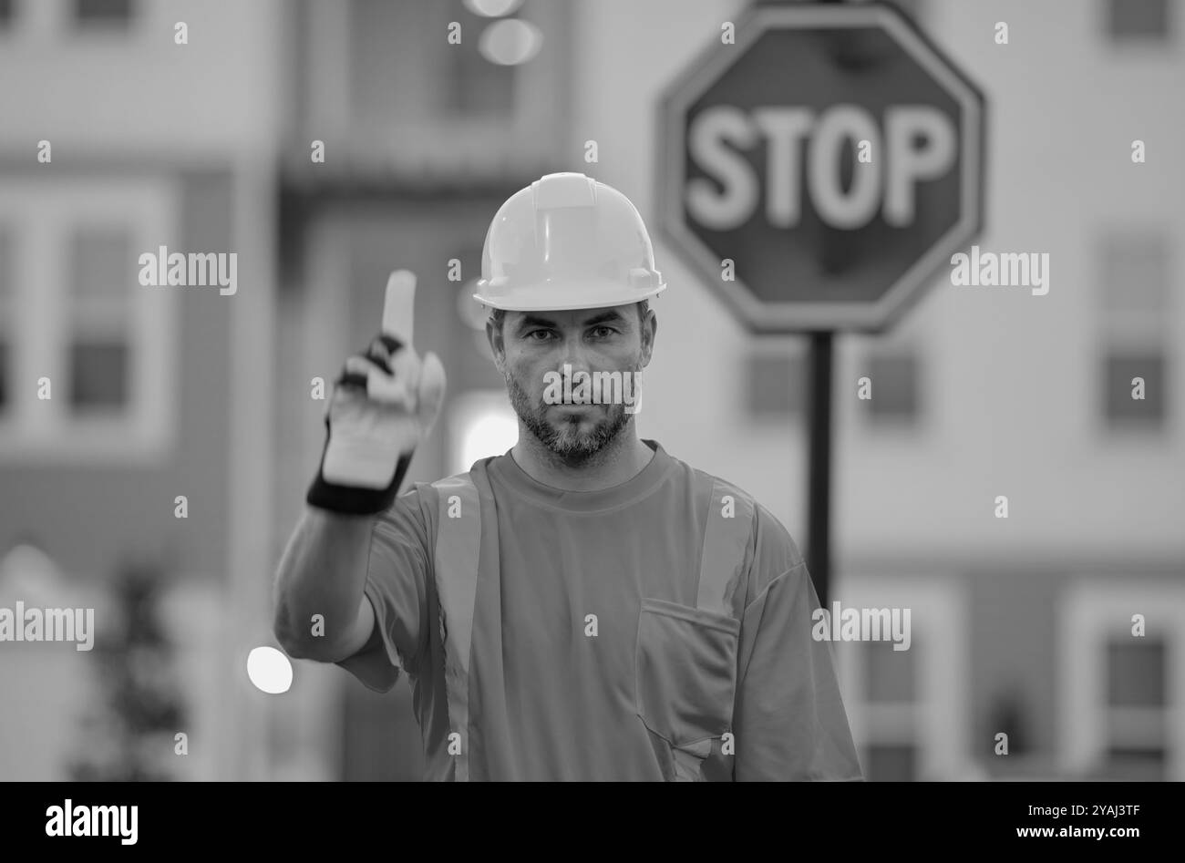 Worker with stop road sign. Builder with stop gesture, no hand ...