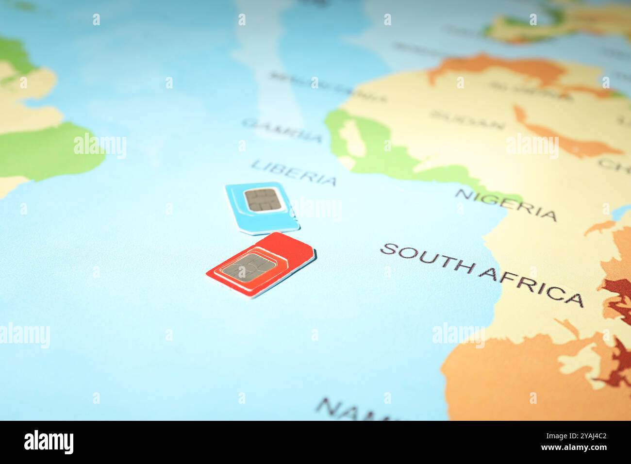 Modern SIM cards on world map, closeup Stock Photo - Alamy