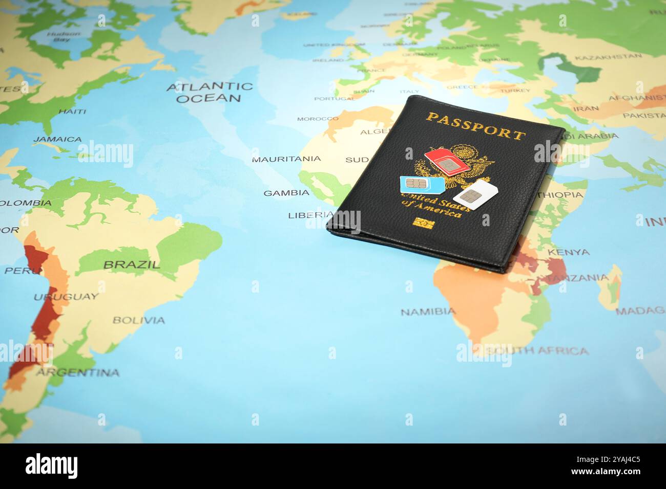 Modern SIM cards and passport on world map Stock Photo - Alamy