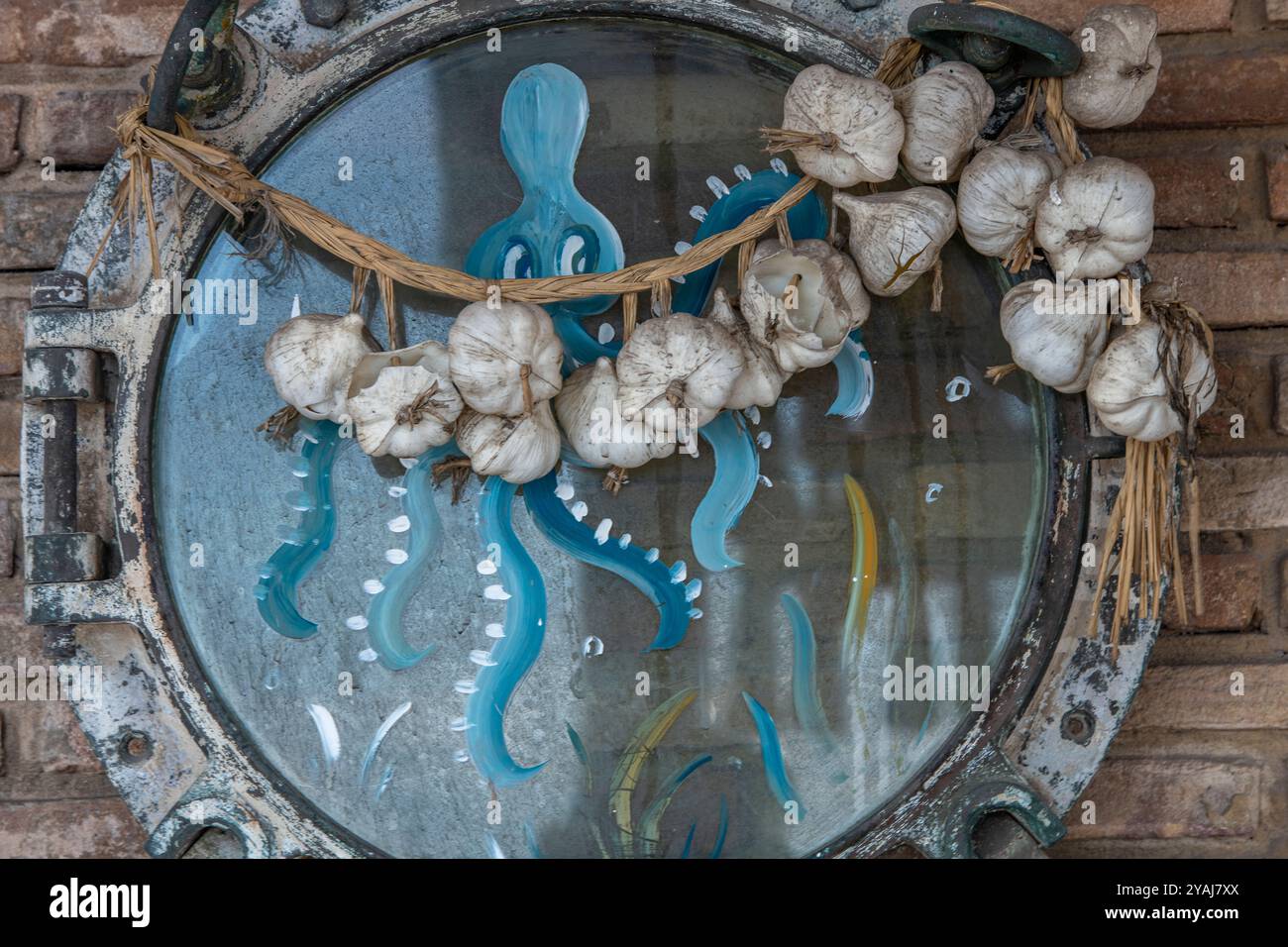 garlic hanging over the window of a Greek taverna or restaurant, garlic ...