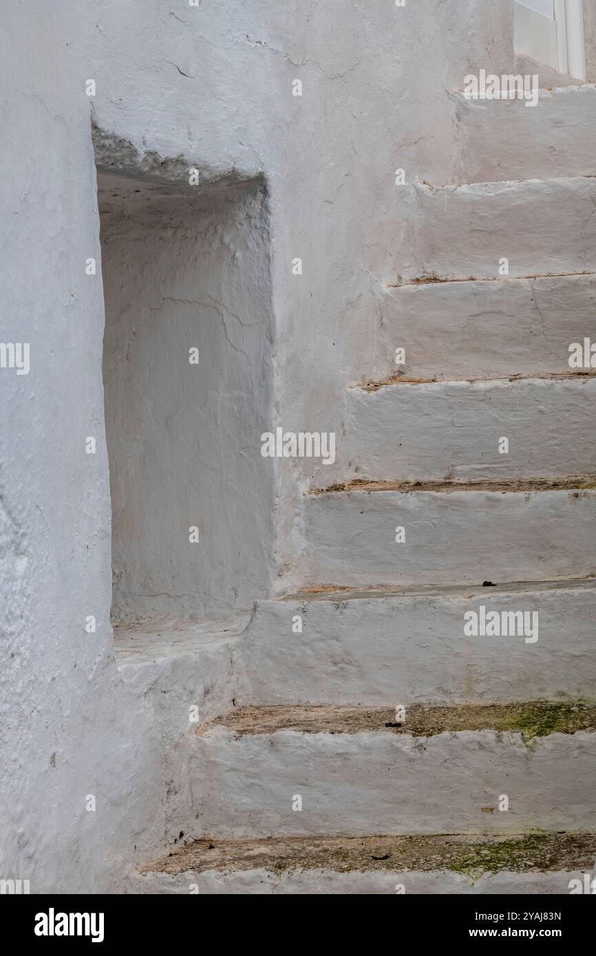 whitewashed wall with a flight of whitewashed stone steps or staircase ...