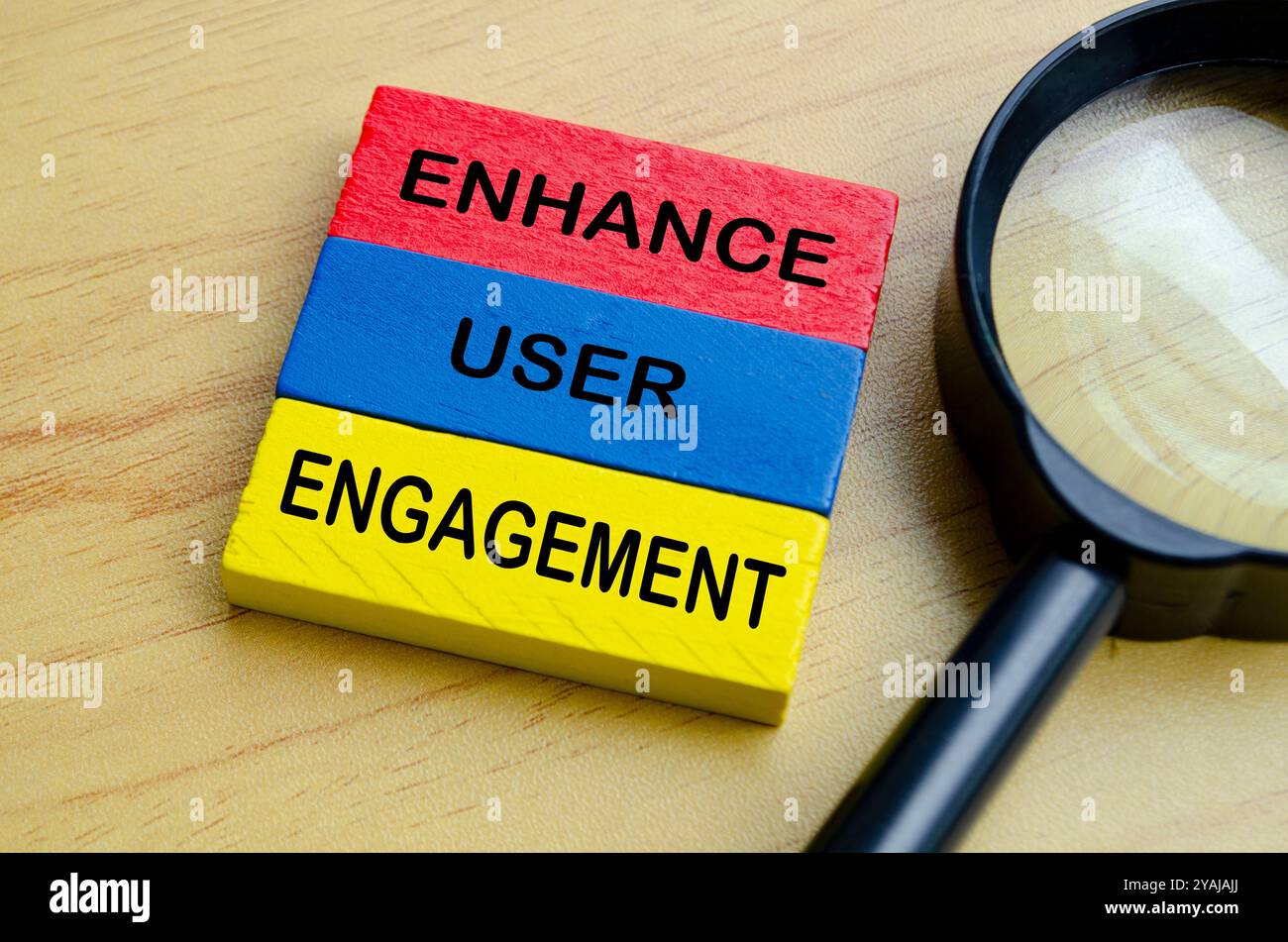 Top view of Enhance User Engagement text on multicolored wooden blocks ...