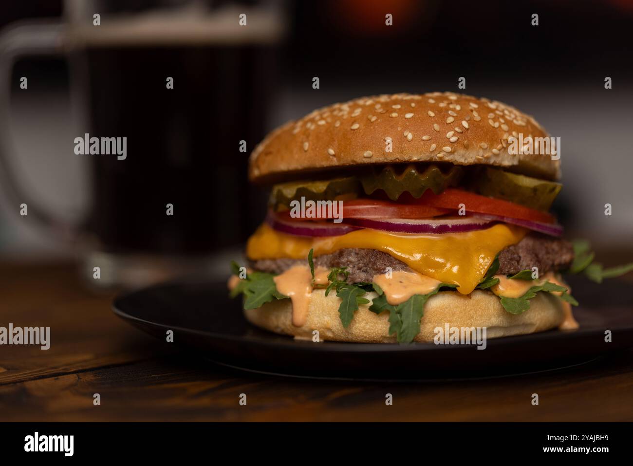 Home made cheeseburger with arugula Stock Photo - Alamy