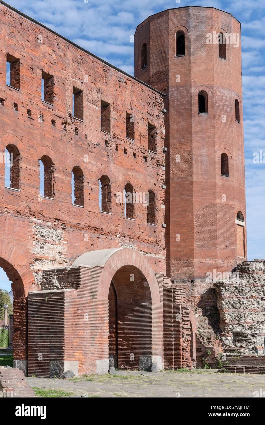 cityscape with gateway and sixteen sided tower at Porta Palatina ...
