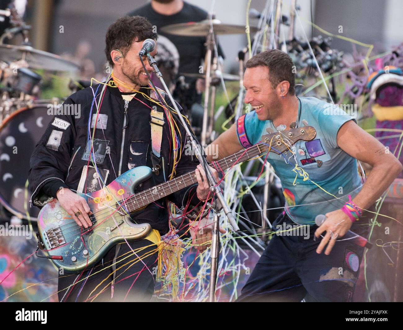 Ny. 08th Oct, 2024. Will Champion, Chris Martin, Coldplay on stage for ...