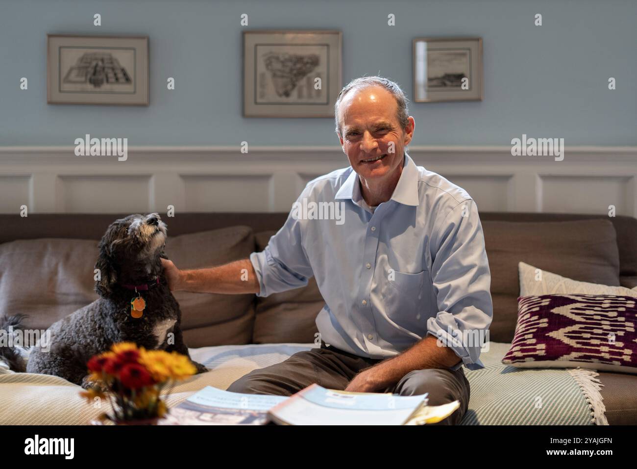 Economist Simon Johnson poses for a photograph with his dog Zoya after ...