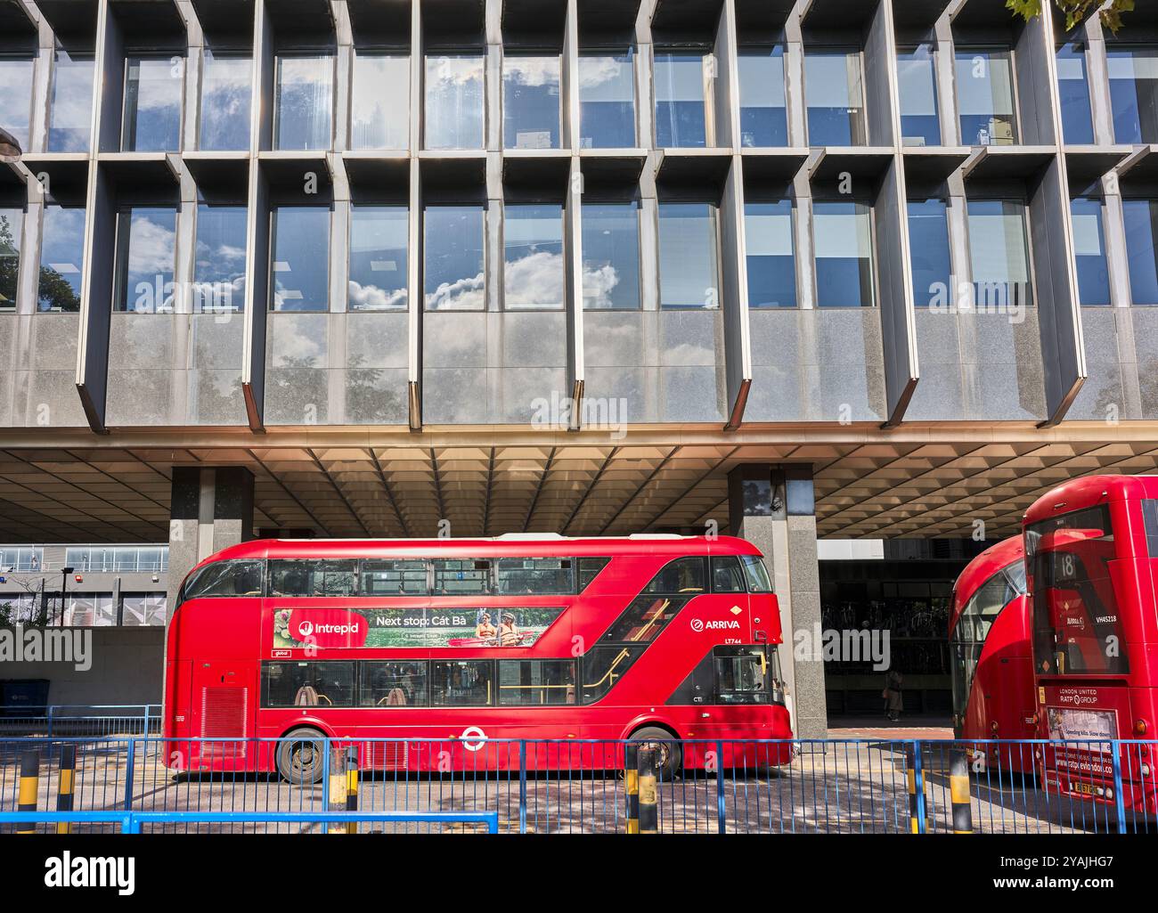 Red double decker buses outside Euston railway station, London, England ...