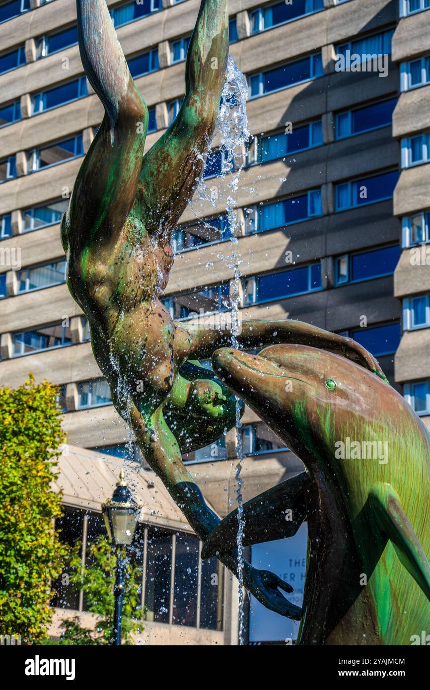 Girl with a Dolphin statue & The Tower Hotel, London Stock Photo - Alamy
