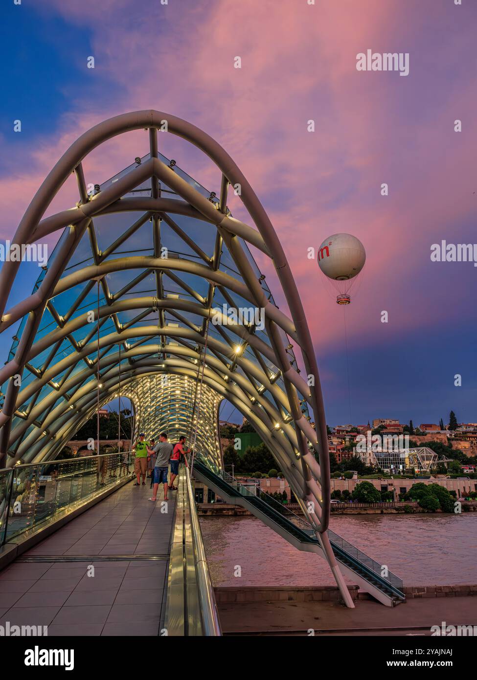 end view of tbilisi peace bridge in early evening with canopy ...