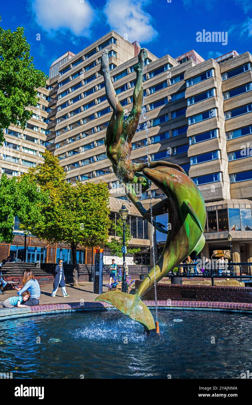 Girl with a Dolphin statue & The Tower Hotel, London Stock Photo - Alamy