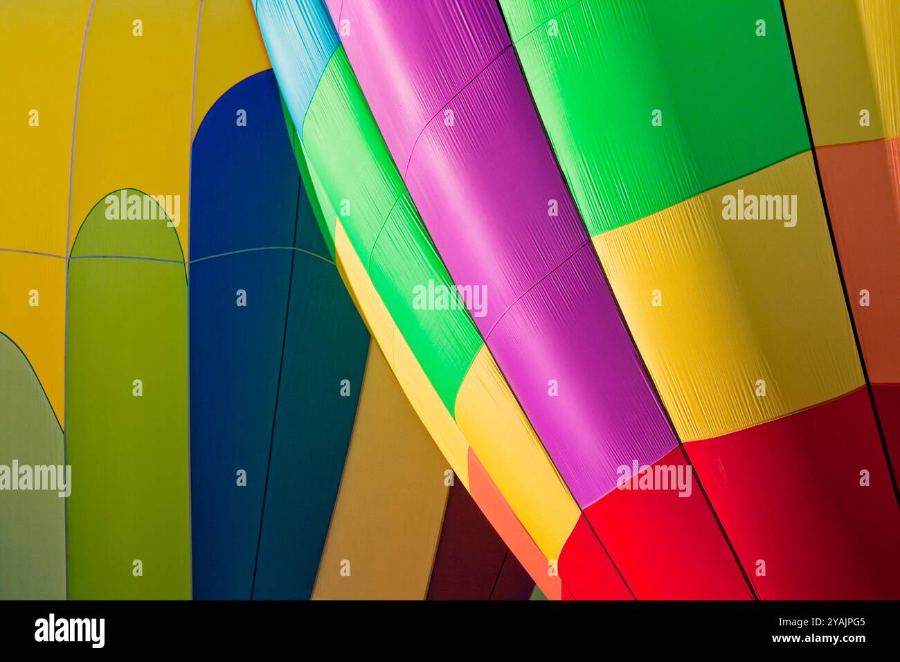 A full-frame background of the colorful patterns of two hot air ...