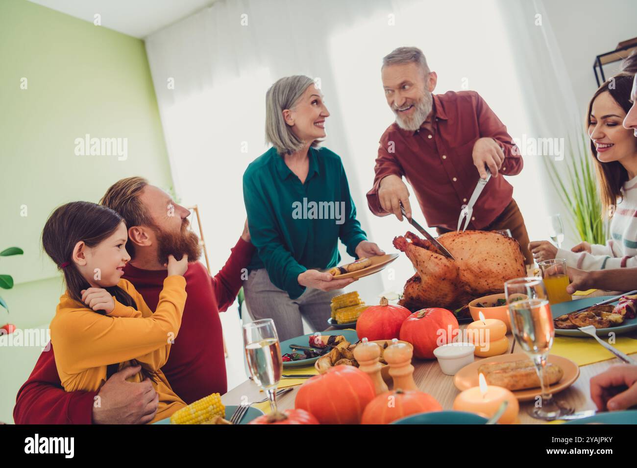 Photo of friendly sweet family cutting turkey eating thanksgiving ...