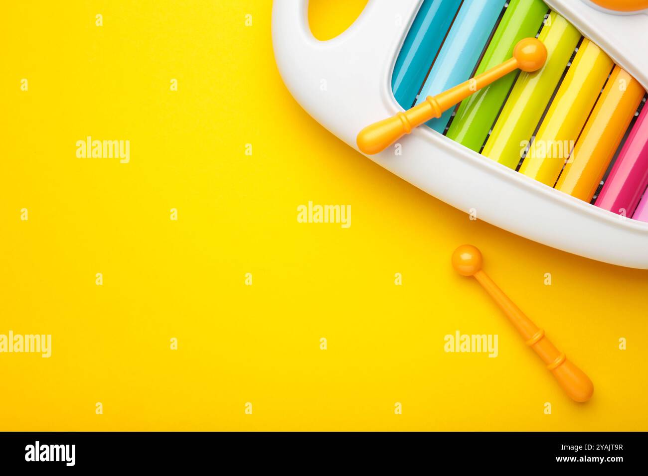 Colorful xylophone on yellow background. Space for text. Top view Stock ...