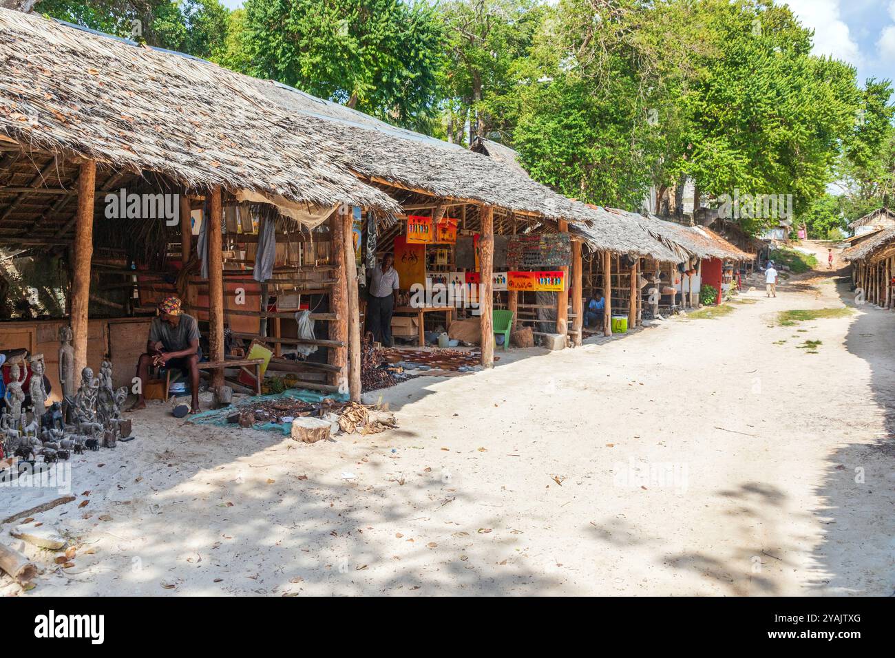 Small local craft market selling souvenirs, walkway between Diani Beach ...