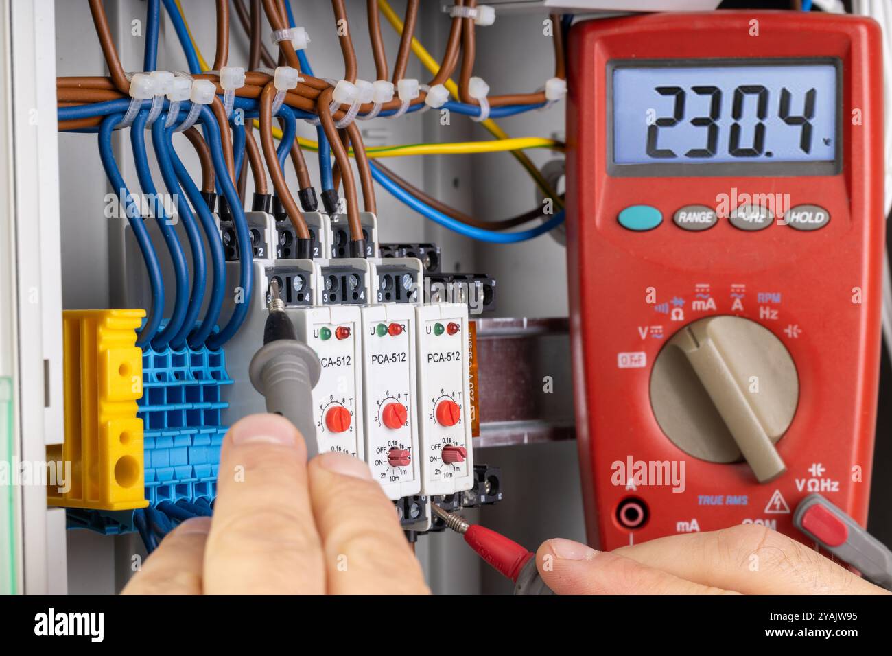 Measuring Voltage in Electrical Panel with Multimeter Stock Photo - Alamy