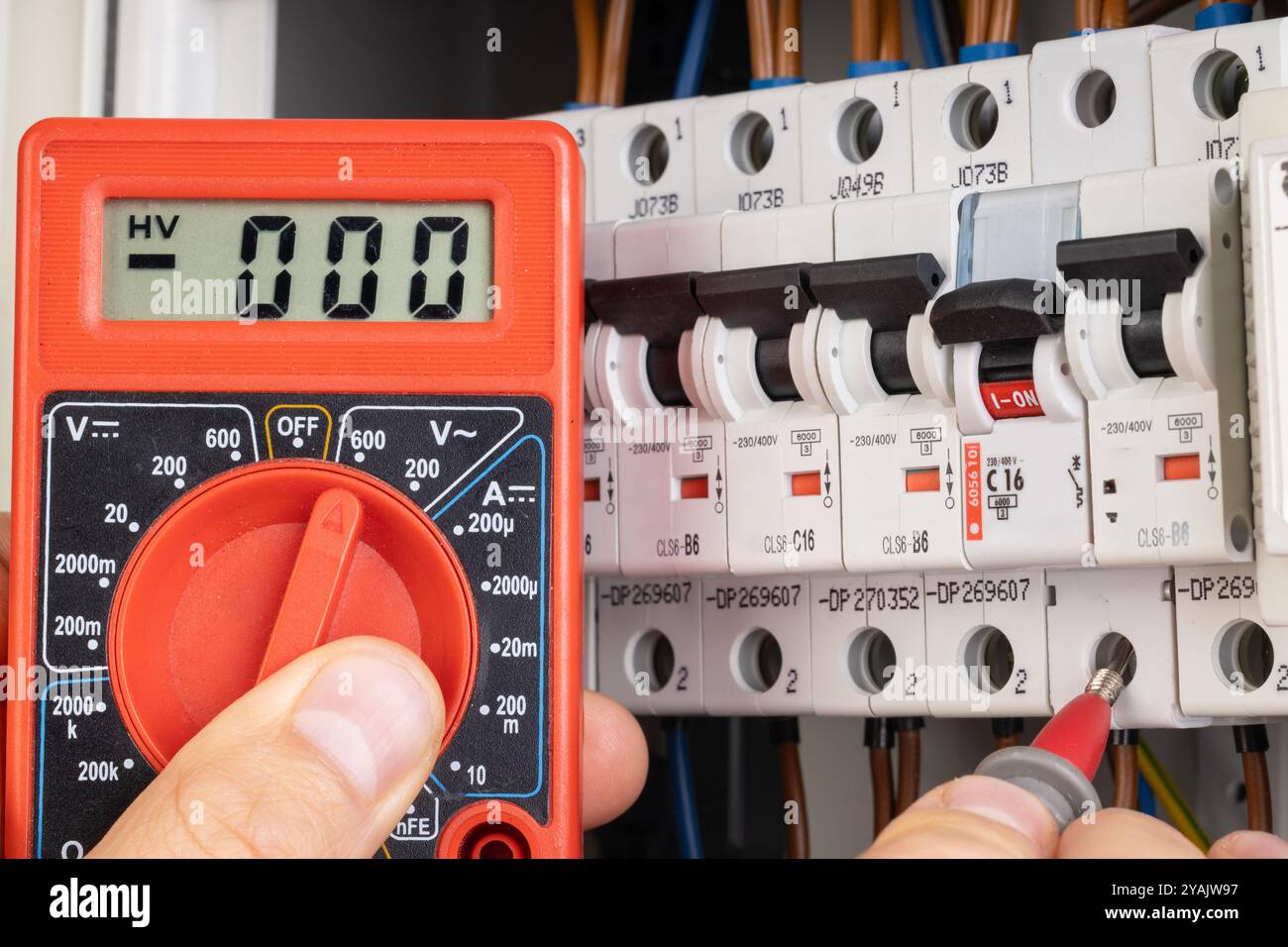 Electrician Testing Circuit Breaker with Multimeter Stock Photo - Alamy