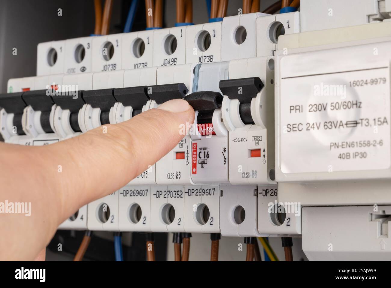 Hand Turning Off Circuit Breaker in Electrical Panel Stock Photo - Alamy