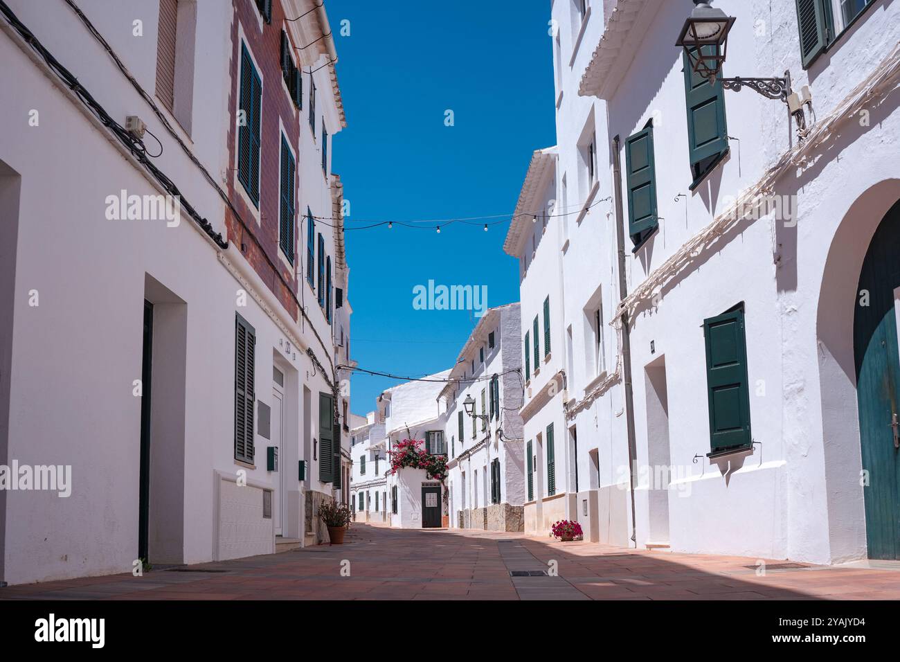 Traditional alley in spanish small town on a sunny summer day with ...