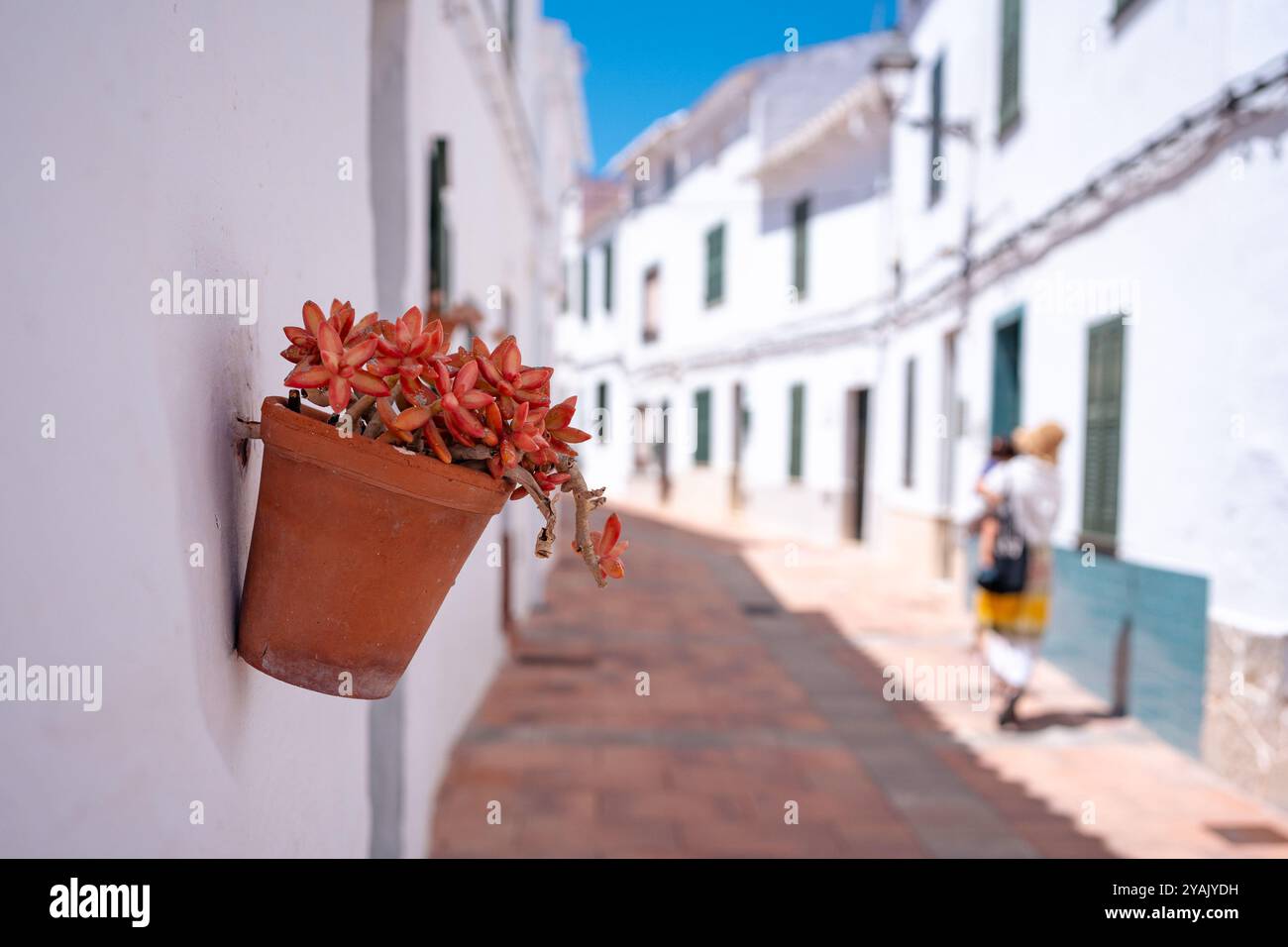 Traditional alley in spanish small town on a sunny summer day with ...