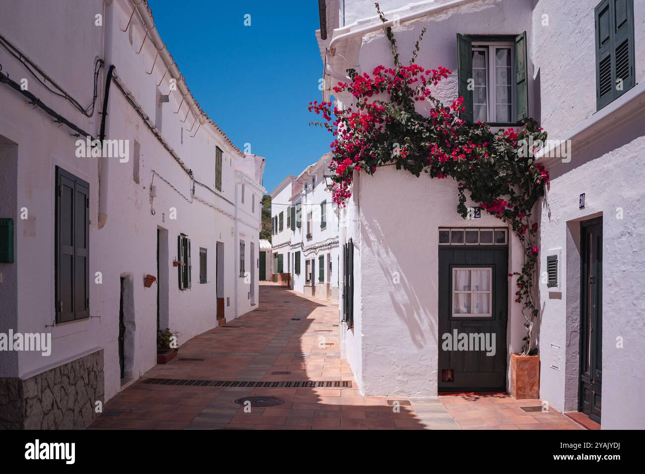 Traditional alley in spanish small town on a sunny summer day with ...
