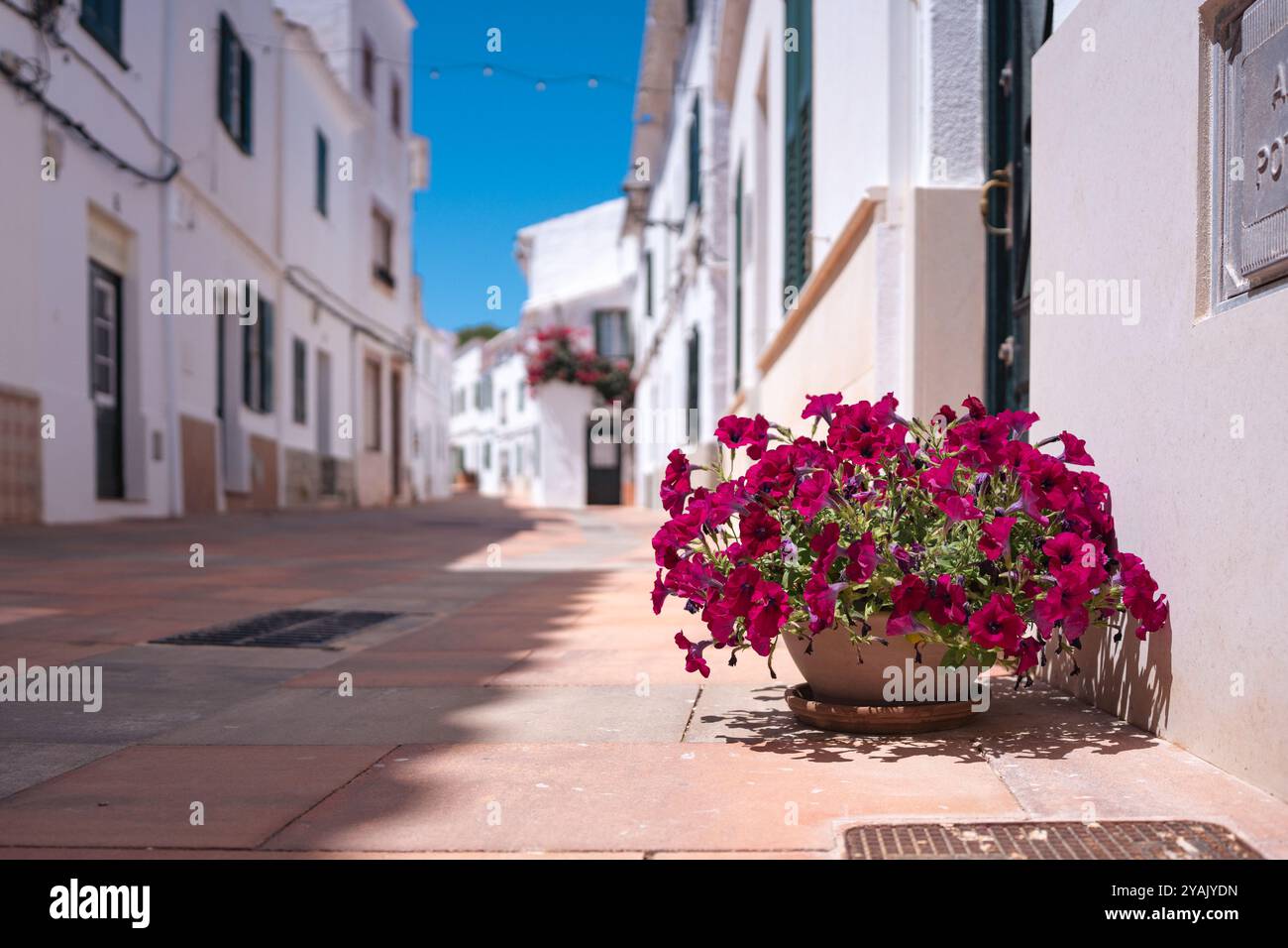 Traditional alley in spanish small town on a sunny summer day with ...