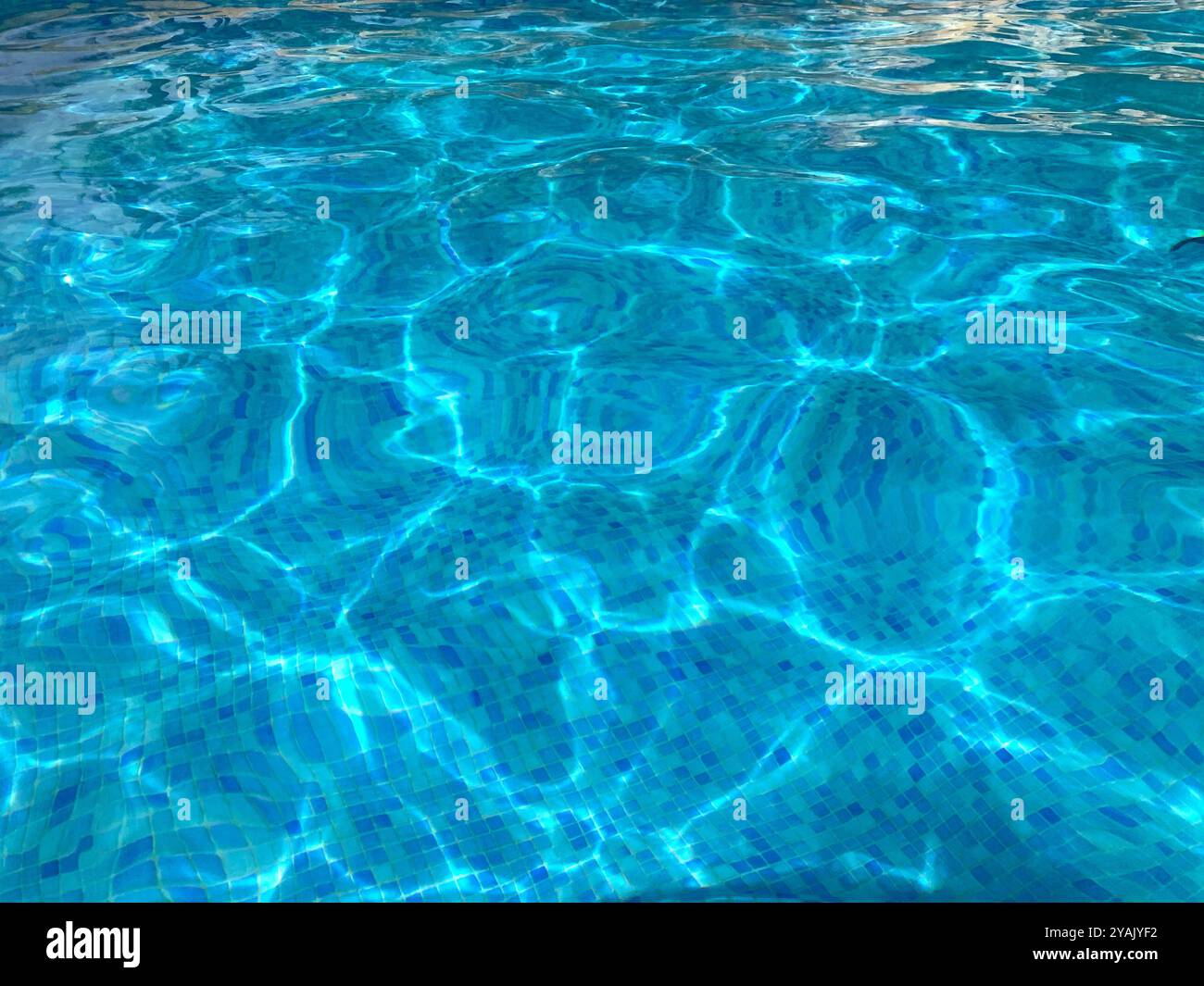 Abstract blue background, ripples in water of tiled swimming pool Stock ...