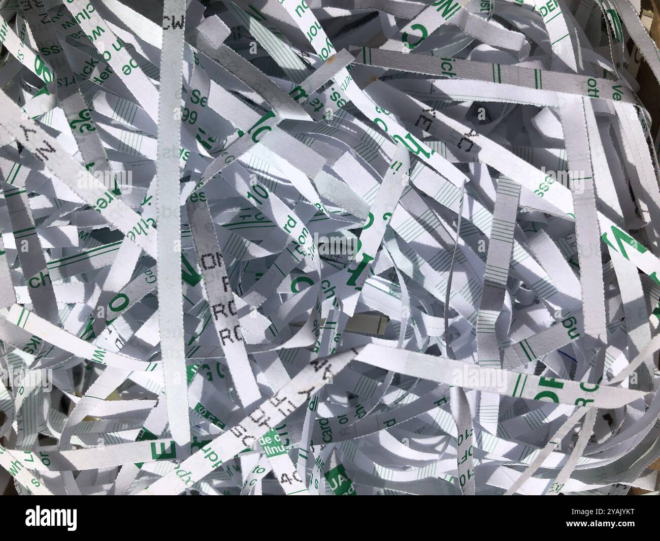 shredded documents, ensuring sensitive data is fully destroyed, concept ...