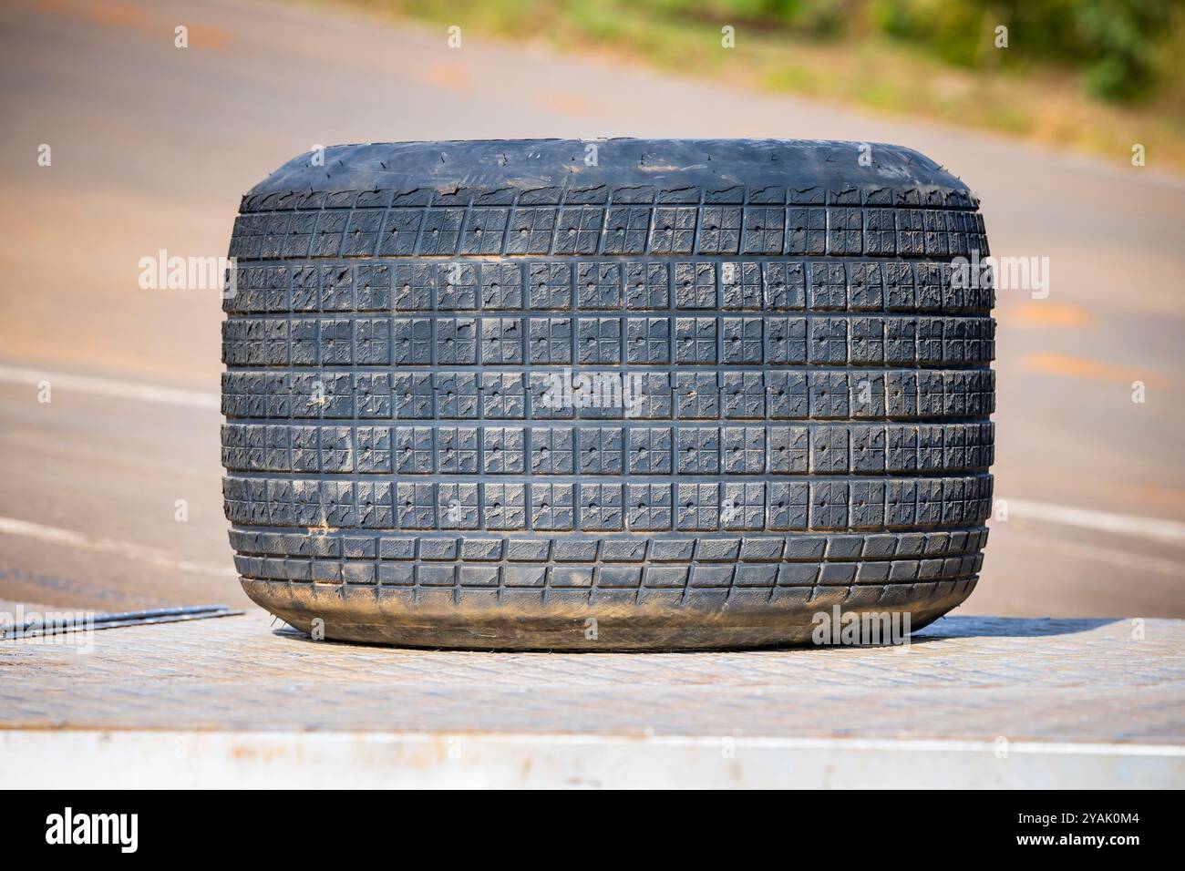 Photograph of a large treaded rubber tyre from a Speedway racing car ...