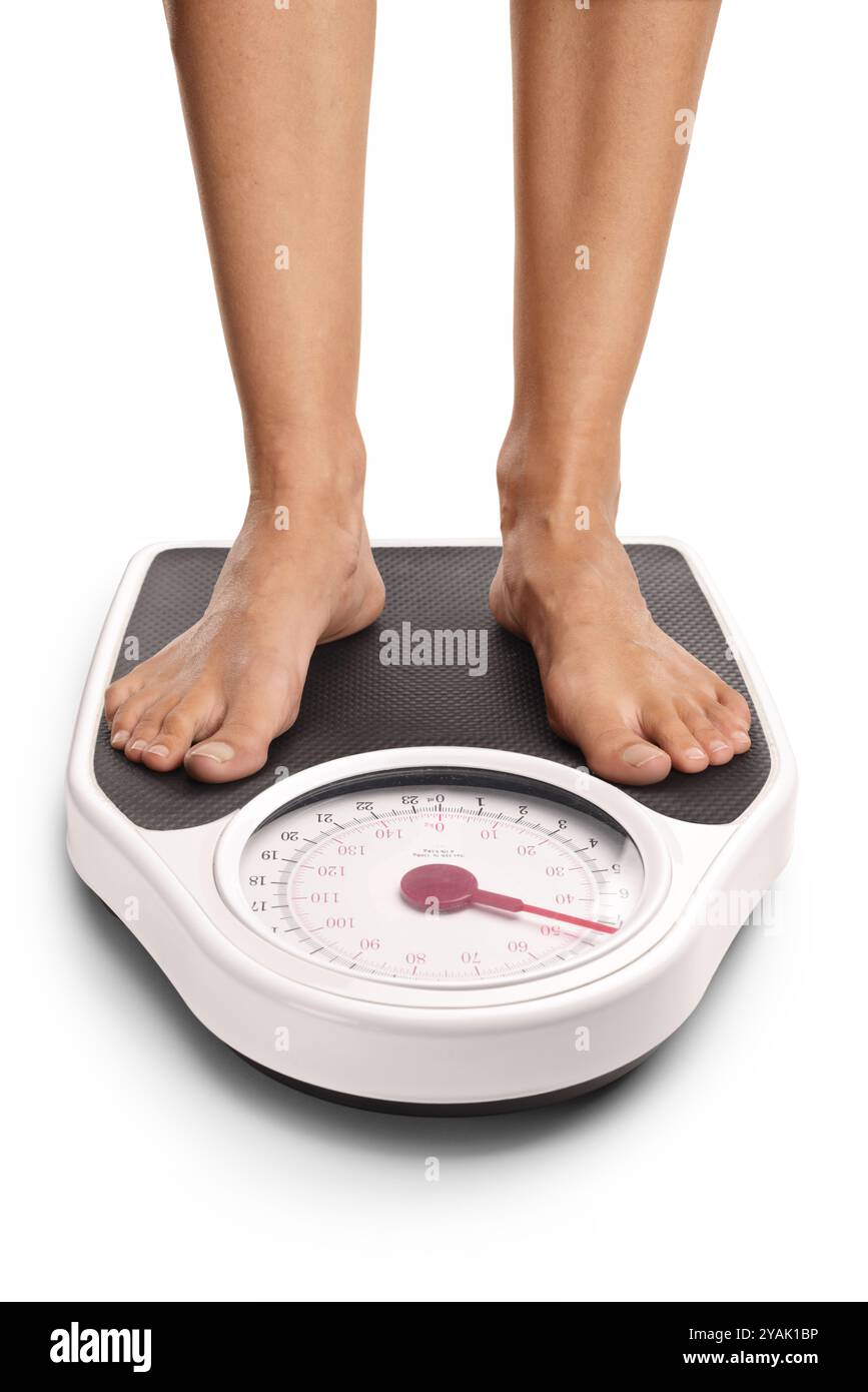 Legs on a weight scale isolated on white background Stock Photo - Alamy