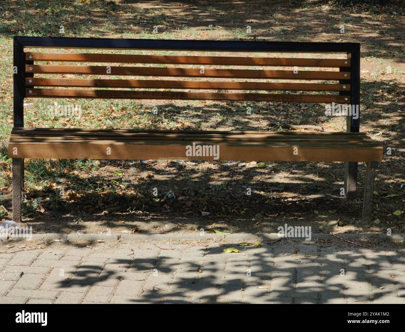 Yellow Park Bench in the Shade, Surrounded by Grass Stock Photo - Alamy