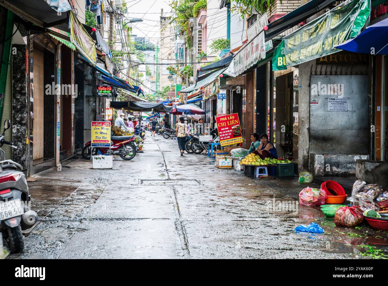 Ho Chi Minh City, November 24, 2022: A shopping street in a residential district of Ho Chi Minh ...