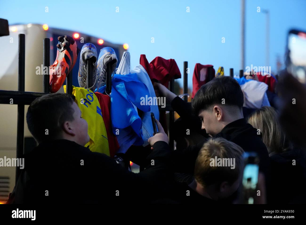 Fans wait outside the gate to see the Portugal squad and get ...
