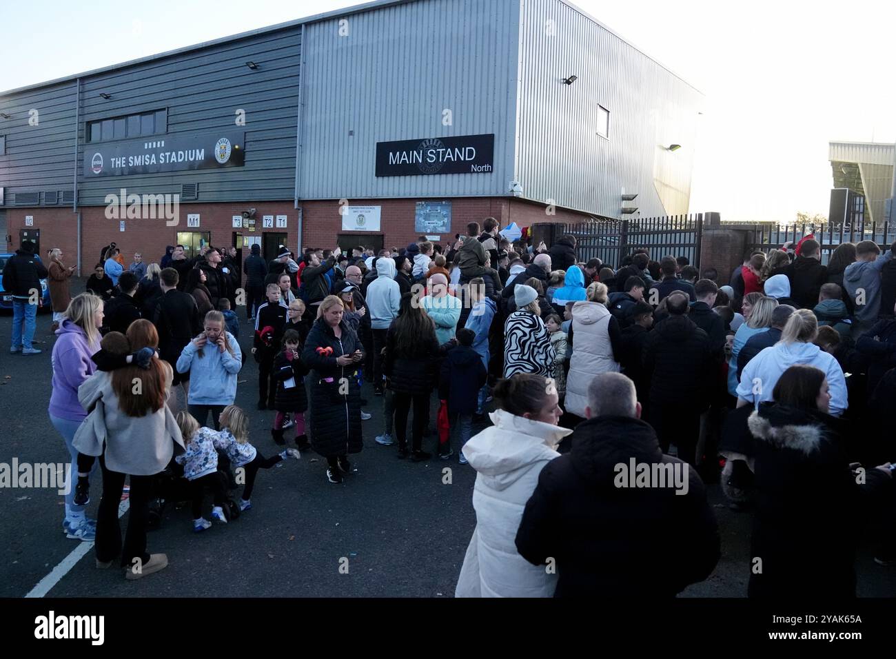 Fans wait outside the gate to see the Portugal squad during a training ...