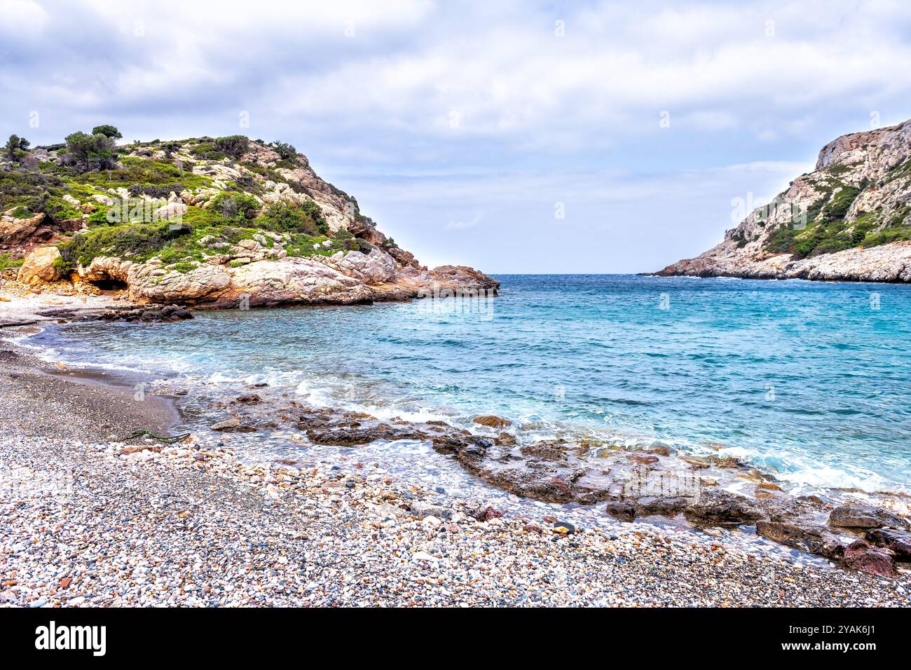 Iero beach on Ikaria island, Greece cove with Ikarian sea waves washing ...