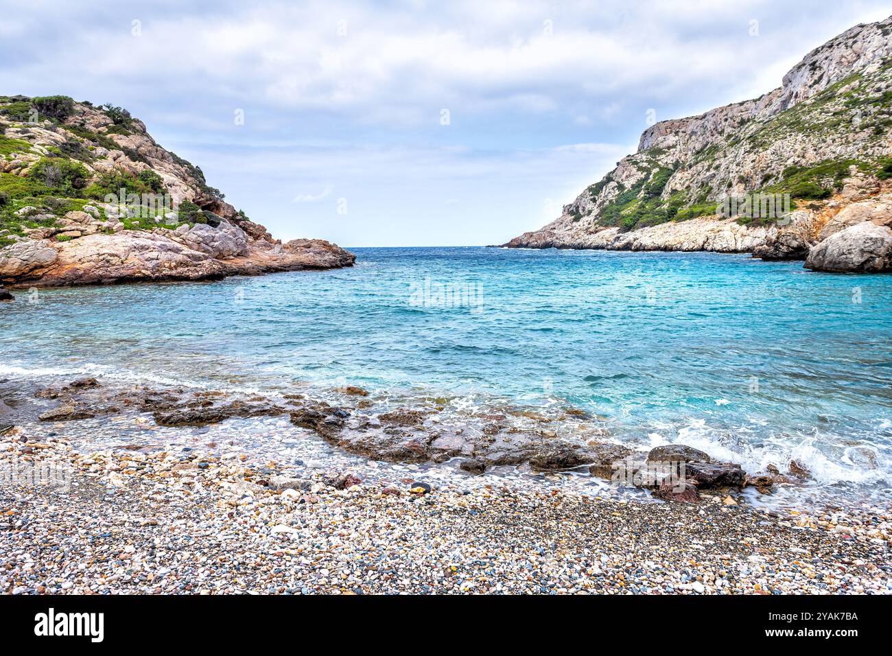 Iero beach on Ikaria island, Greece cove with Ikarian sea waves washing ...