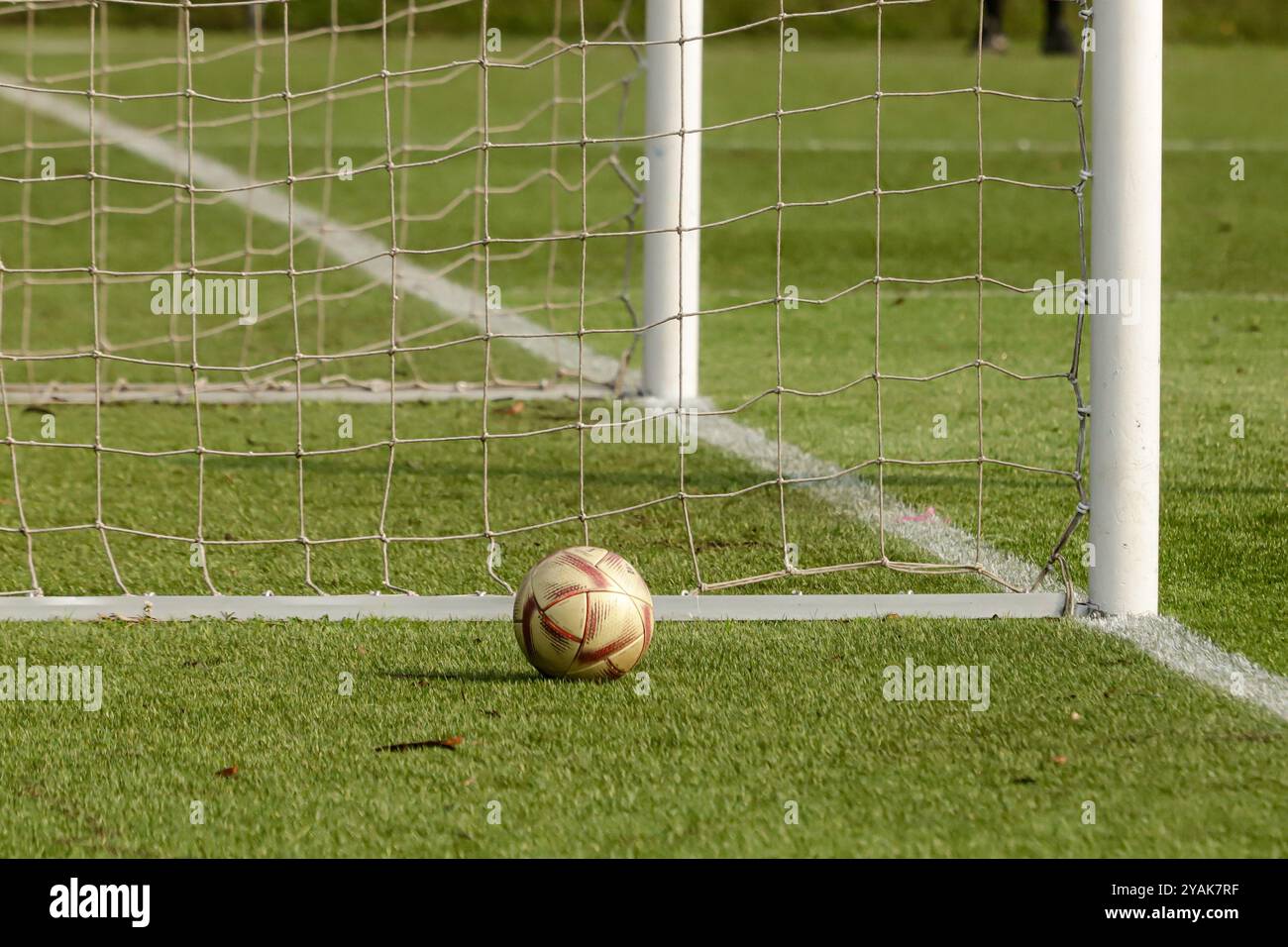 Football pitch with synthetic grass, with a ball in the lower third ...