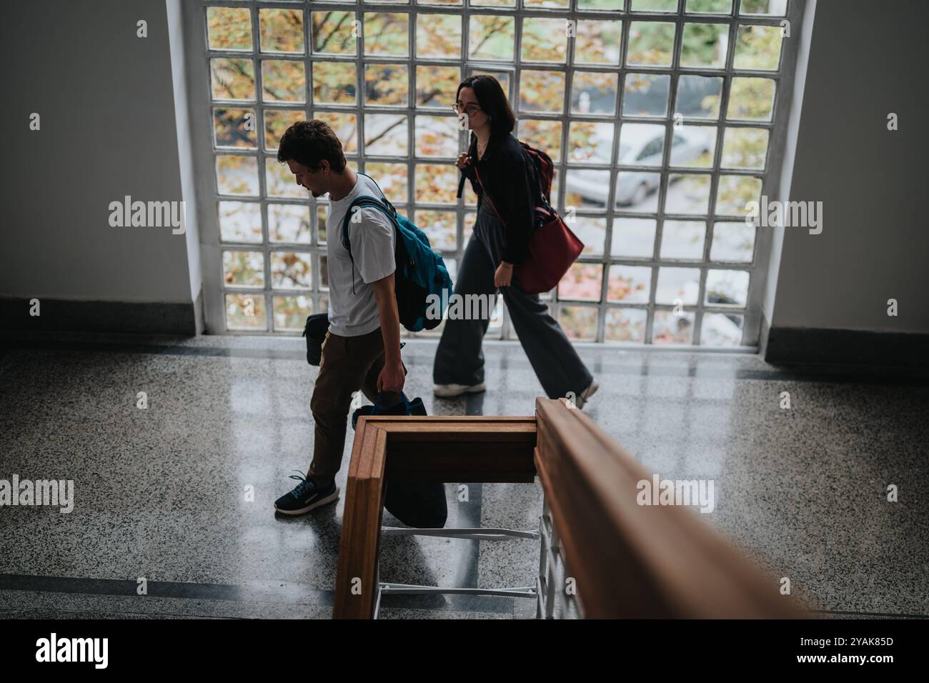 Students walking up staircase in a modern university building Stock ...