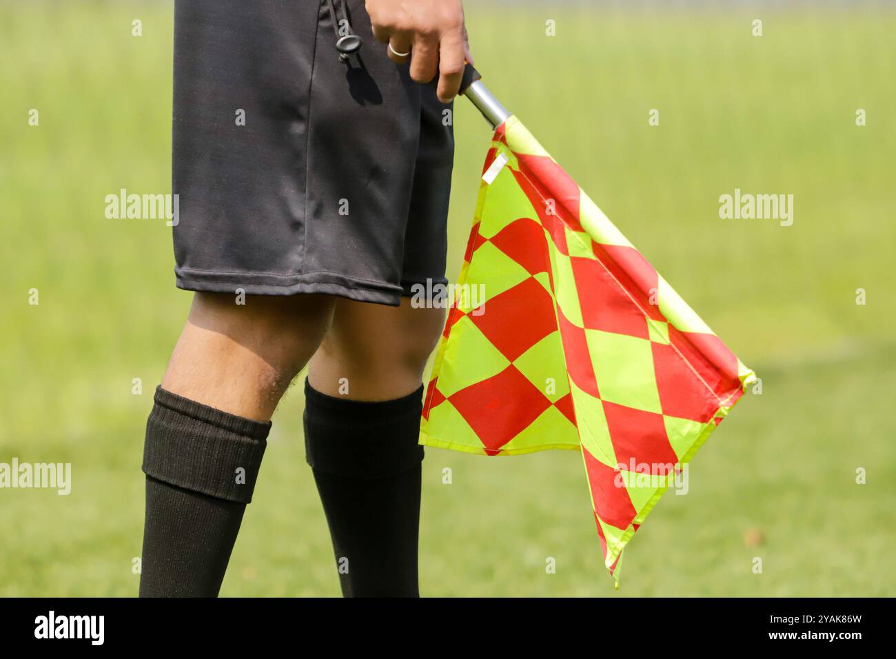 Football referee who oversees the sides of the field, known as linesmen ...