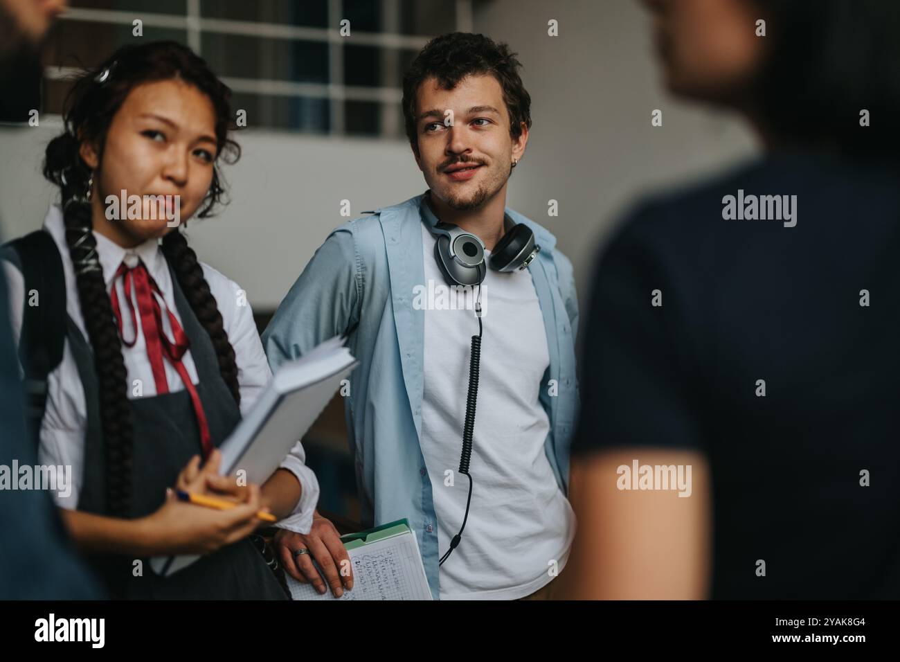 Students engaging with professor in an outdoor educational setting ...